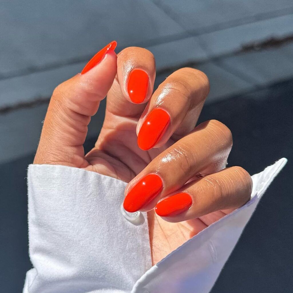 The Red Nail Colors Nail Artists Love on Deep Skin Tones